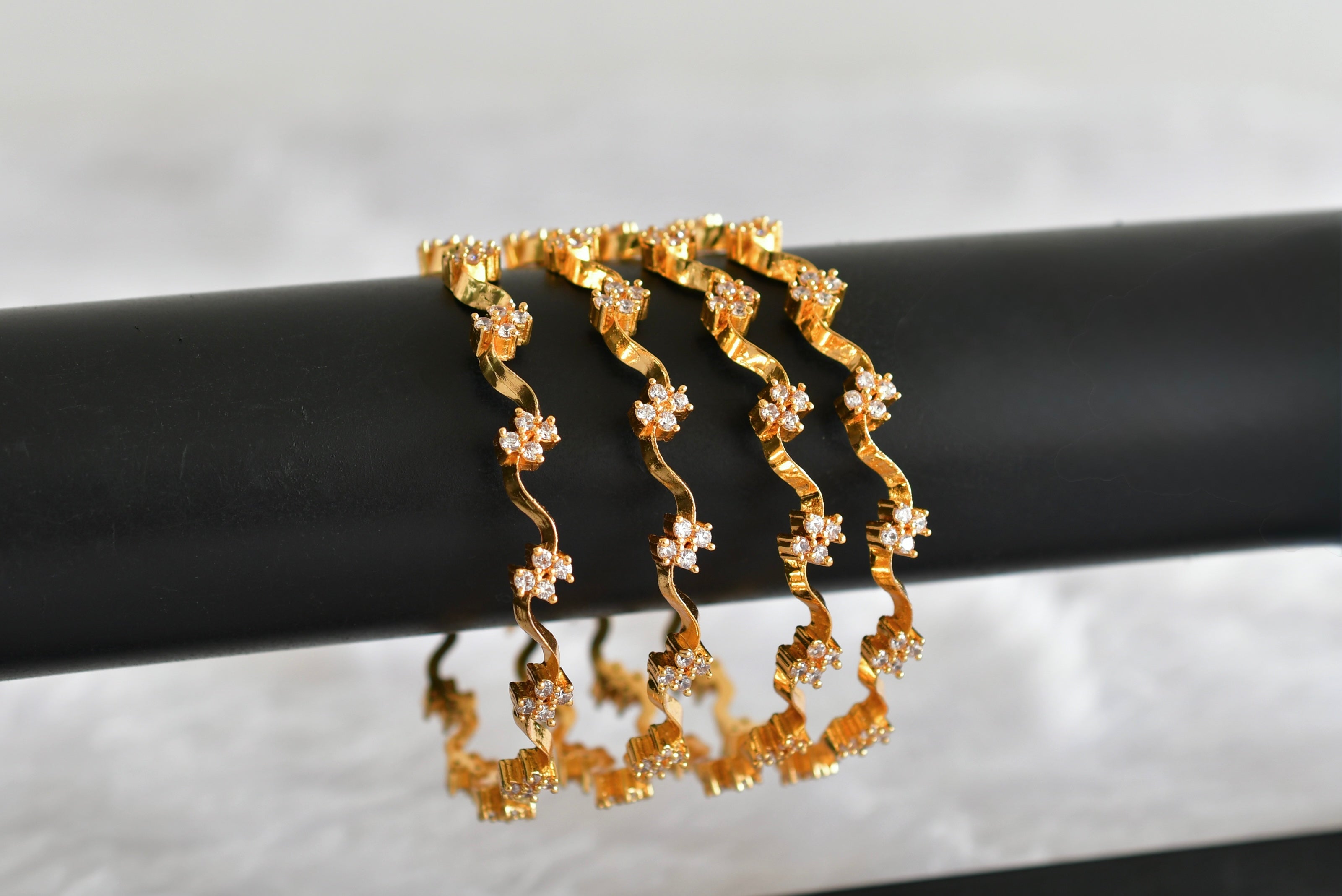 Gold tone cz white set of 4 bangles(2.6) dj-51792 – dreamjwell