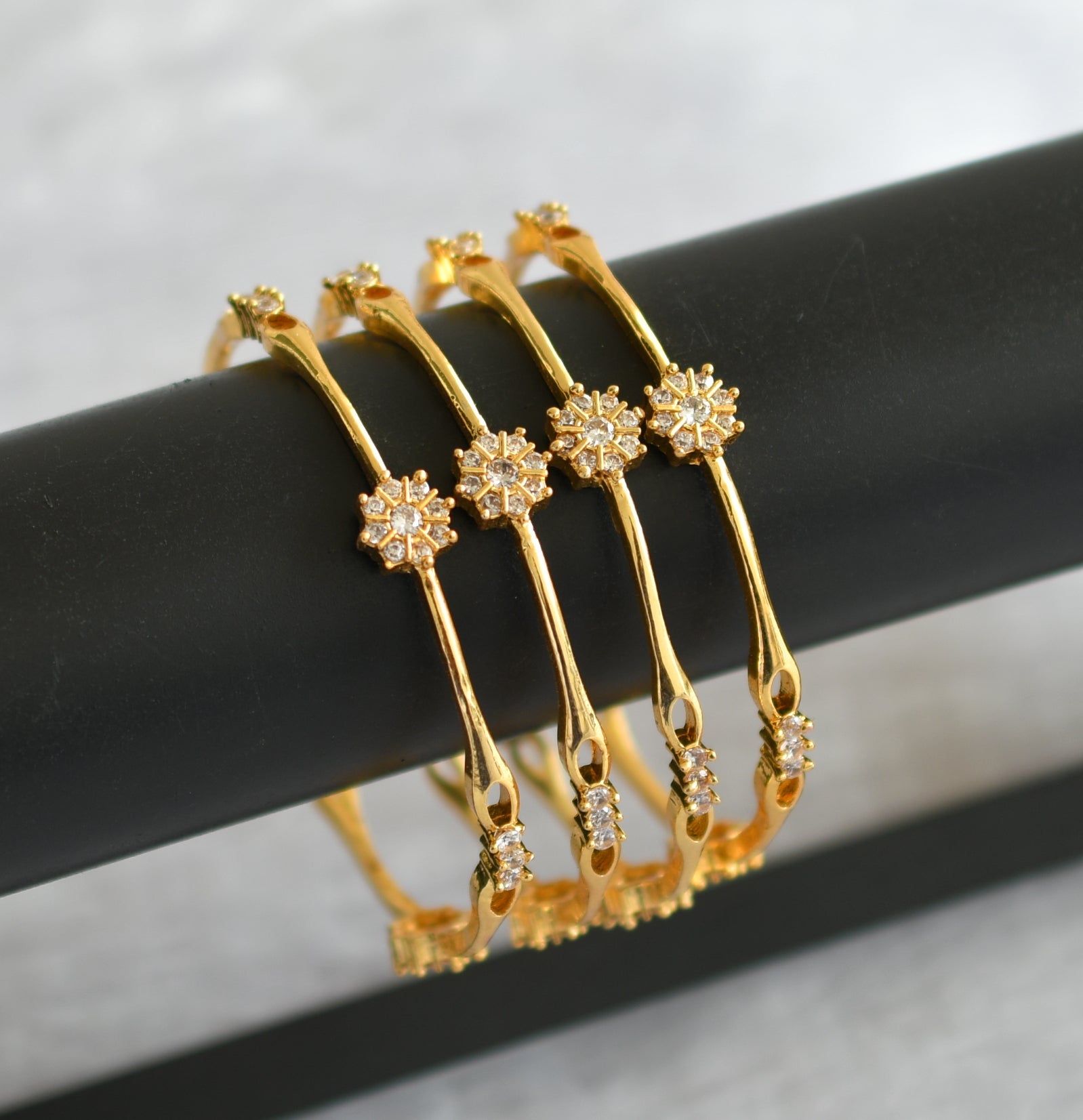Gold tone cz white flower set of 4 bangles(2.8) dj-46286 – dreamjwell