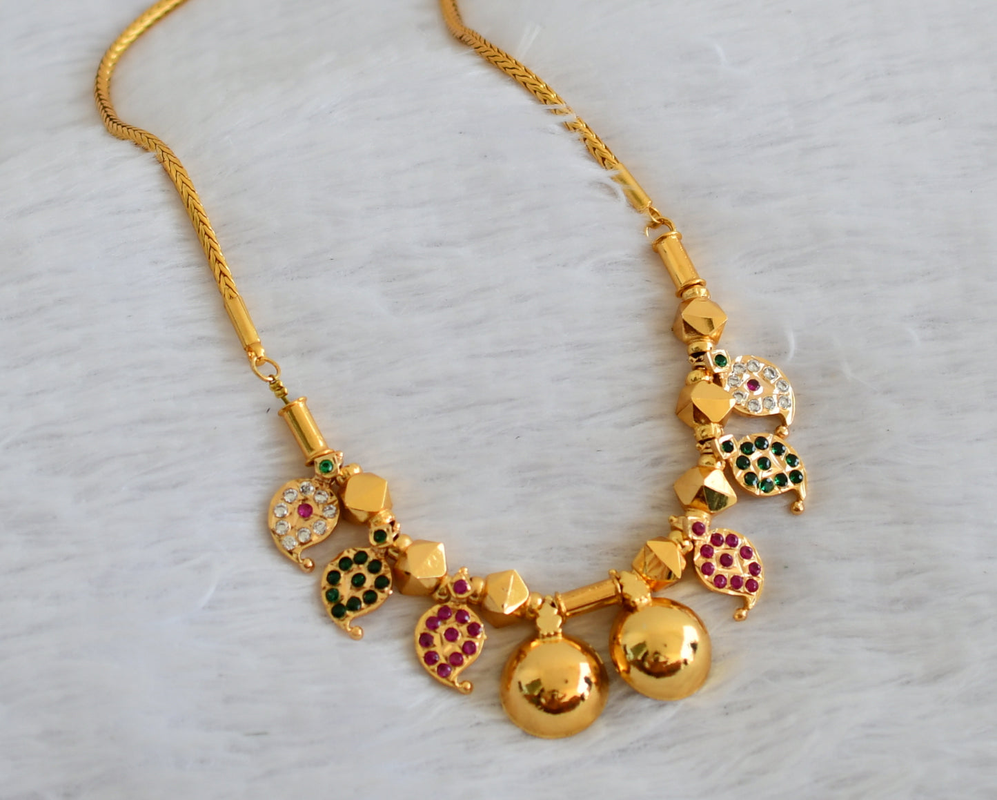 Gold tone 24 inches kodi chain with pink-green-white stone mango bottu ...