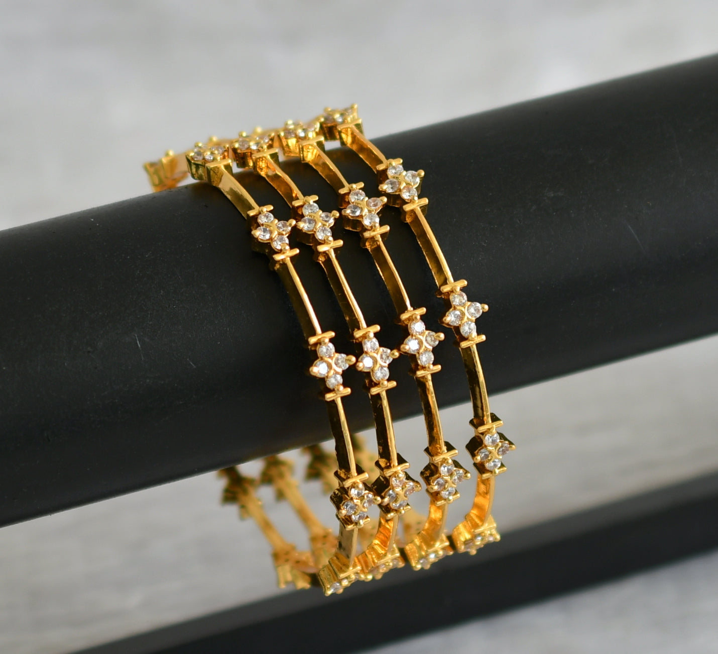 Gold tone cz white set of 4 bangles(2.4) dj-48167 – dreamjwell