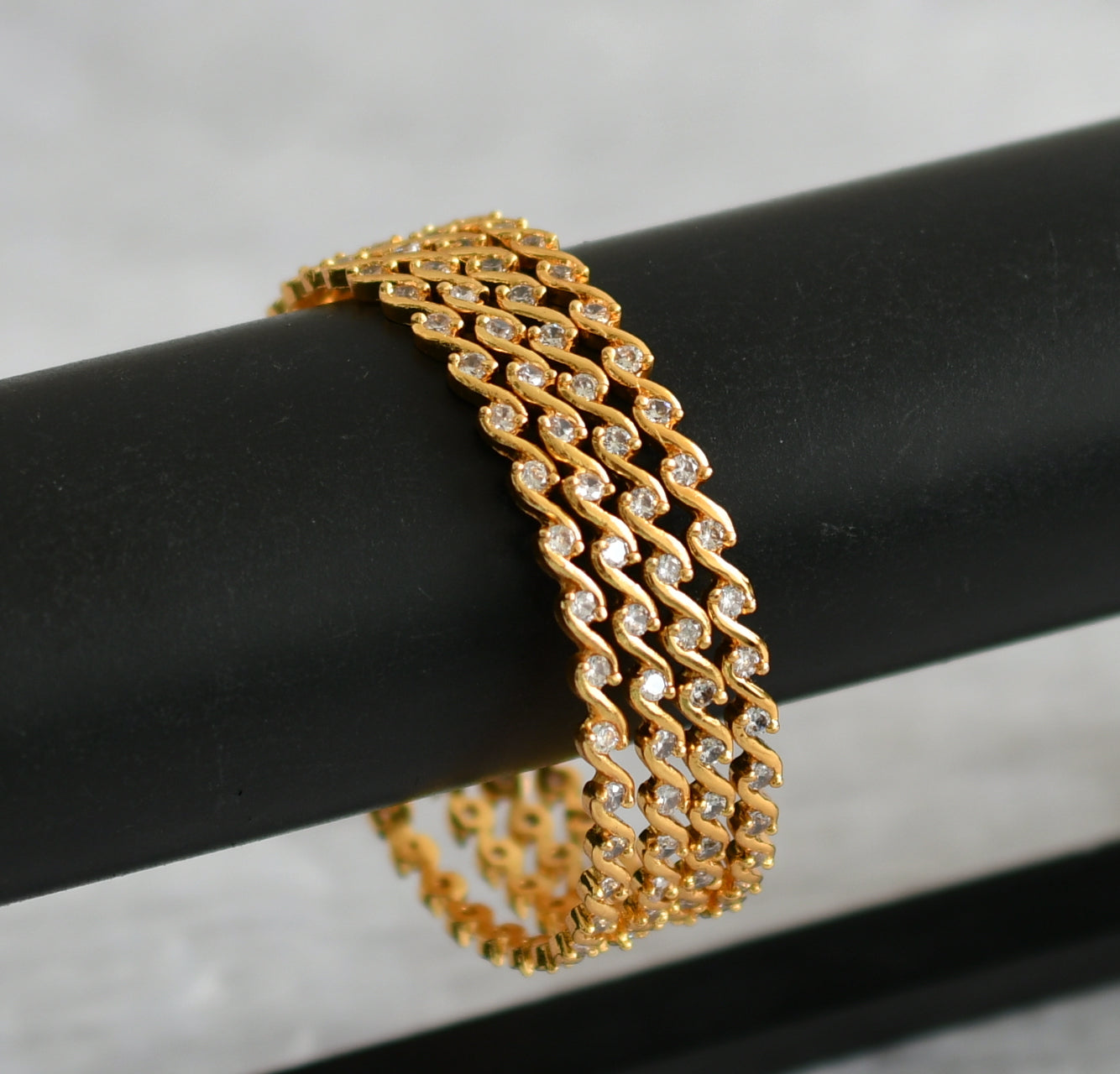 Gold tone cz white stone set of 4 bangles(2.4) dj-46899 – dreamjwell