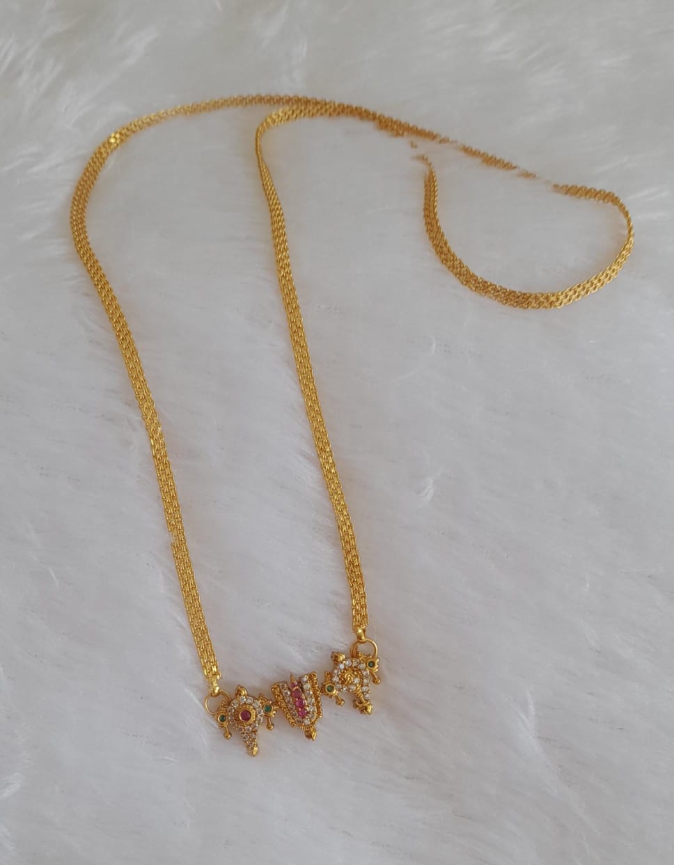 Gold tone 24 inches chain with cz ruby-green shanku-nama-chakra pendan ...