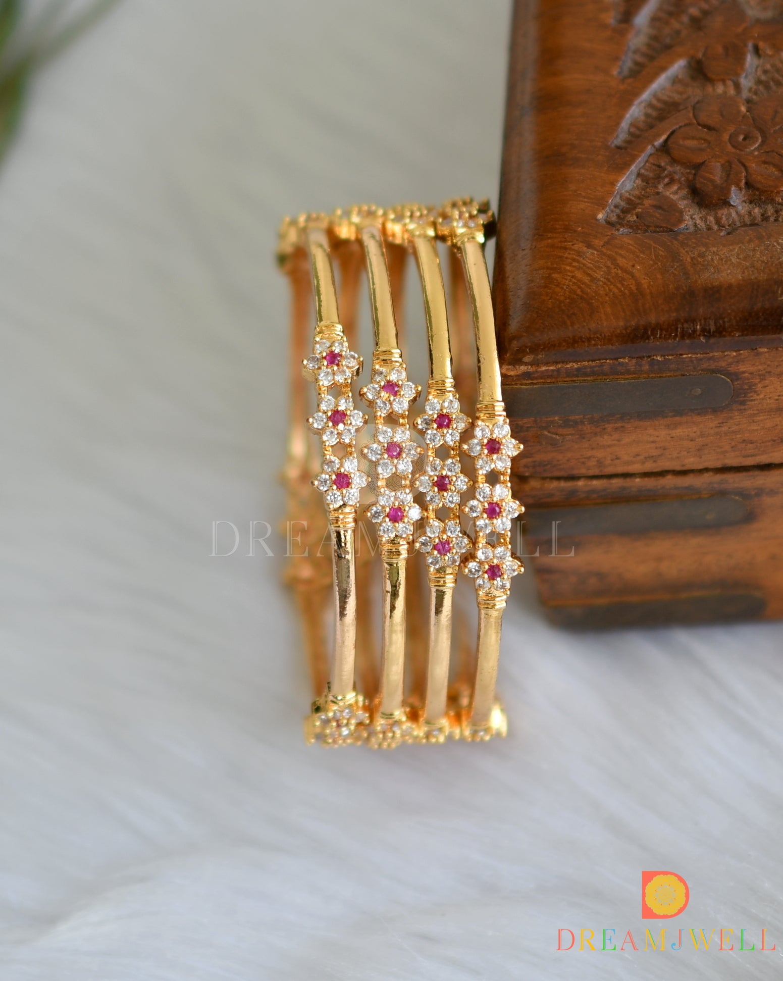 DREAMJWELL - Beautiful Gold Tone Cz Ruby nakshatra Designer Set Of 4 ...